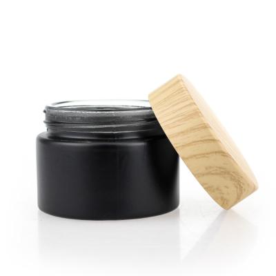 China Black Matte Glass Jars 50g Cosmetic Packaging Set Bamboo Color Screw Cap for sale