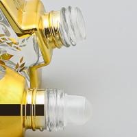 China Beauty Packaging Mini Glass Roll On Bottles 12ml For Perfume Packaging Golden Glittering for sale