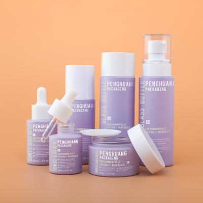 China Cylinder Glass Skincare Jars 100ml 60ml 50ml Lotion Pump Bottle Empty Cosmetic Packaging Set for sale