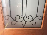 China Oval Shaped Iron Glass Entry Doors , Antiseptic Wrought Iron Doors With Glass for sale
