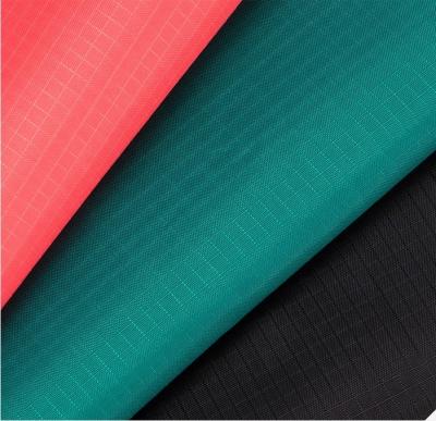 China 210D Ripstop Oxford Fabric Waterproof Tear Resistant 100% Polyester 90-120gsm for Camping Tent Backpack for sale