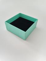 China Flexo Cosmetic Paper Printed Packaging Box Embossing Bright Green for sale