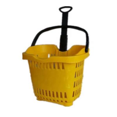 China Custom Logo Supermarket Red Plastic Shopping Basket With Two Wheels T Handle for sale