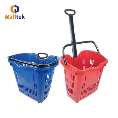 China Red Telescopic Handle Plastic Rolling Basket With Two Wheels For Convenience Store for sale