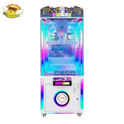 China Lucky Clip Machine 68 Clips Skill Coin Operated Game Arcade Machine Neo Spin Claw Crane Clamping Gift Machine for sale