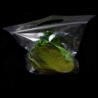 China Customized Ventilated Plastic Bags Biodegradable Clear Vegetable Bags With Die Cut Handle for sale