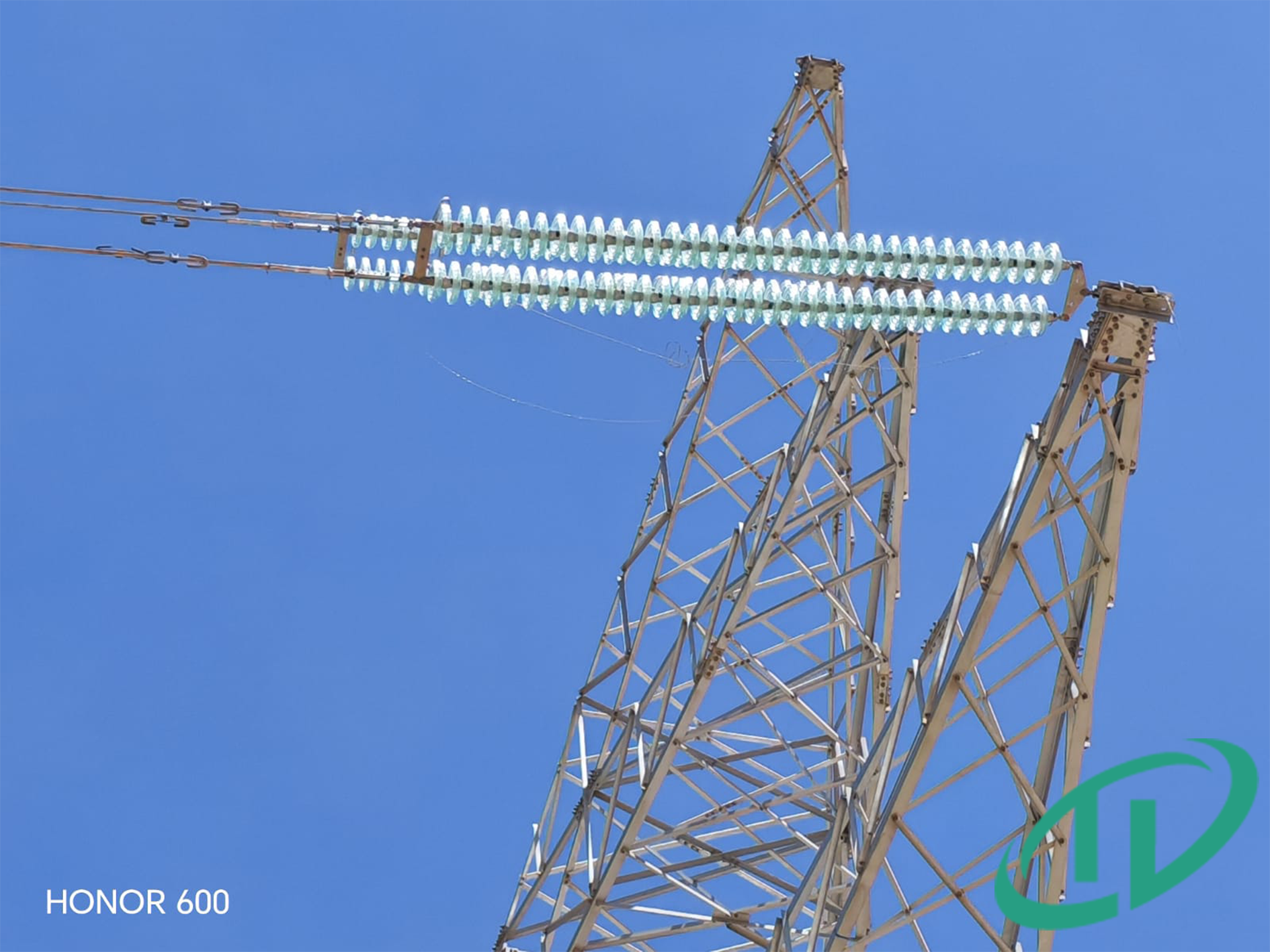 Toughened glass suspension insulators on a high-voltage transmission tower