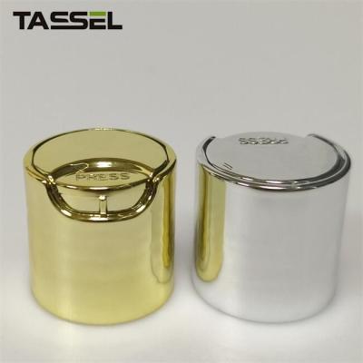 China Shiny Gold UV Coated Plastic Bottle Cap 24/410 Disc Top Cap for Lotion for sale