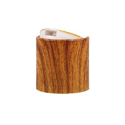 China Tassel 28-410 Lotion Bottle Caps Wooden Effect Plastic Bottles Disc Top Caps for sale