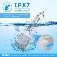 China Cordless Handheld Oral Irrigator IPX7 Waterproof 300ml Water Tank 5 Modes Dental Flosser for sale