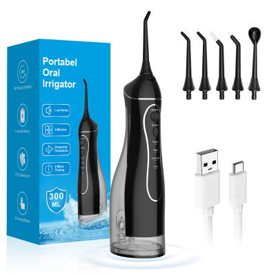 China Cordless Water Flosser 300ML IPX7 Waterproof Oral Irrigator with 4 Jet Tips and 1200-1400 PPM for sale