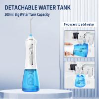 China IPX7 Waterproof Electric Dental Flosser 1200-1400 Pulse Frequency 300ML Tank for sale