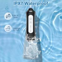 China Portable Waterproof IPX7 Electric Oral Irrigator with 300ML Tank and 1200-1400 Pulse Frequency for sale
