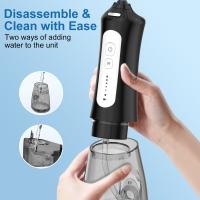 China Portable Waterproof IPX7 Electric Oral Irrigator with 300ML Tank and 1200-1400 Pulse Frequency for sale