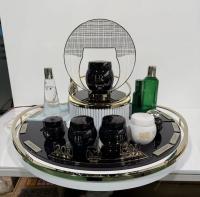 China Rotating Acrylic POS Display with Glossy Black Acrylic and Polished Gold Metal Frame Acrylic Display Stand for Skincare for sale
