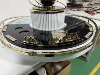 China Rotating Acrylic POS Display with Glossy Black Acrylic and Polished Gold Metal Frame Acrylic Display Stand for Skincare for sale
