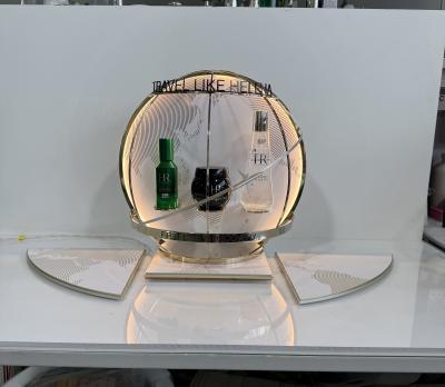 China Globe-shaped Acrylic POS Display with Polished Gold Metal Frame and Built-in LED Backlighting for Luxury Skincare Retail for sale