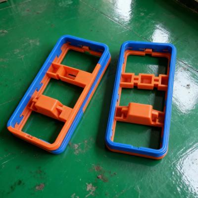 China Custom Double Color 2K Injection Molding Parts OEM Plastic Overmolding Frame Housing Manufacturer for sale