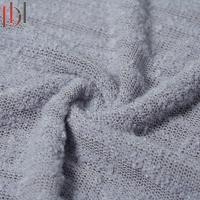China Hot Garment Bag Polar Textile Woven Upholstery Skin Friendly Coral Fleece Fabric for sale