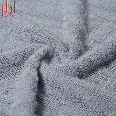 China Hot Garment Bag Polar Textile Woven Upholstery Skin Friendly Coral Fleece Fabric for sale