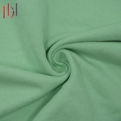 China 100% Cotton Fabric Green French Sheepskin Premium Cotton Material Winter Spring Sportswear Cotton Hoodie Fabric for sale