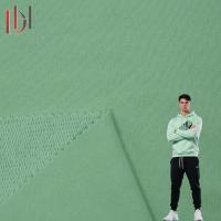 China 100% Cotton Fabric Green French Sheepskin Premium Cotton Material Winter Spring Sportswear Cotton Hoodie Fabric for sale
