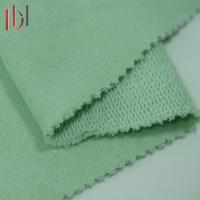 China 100% Cotton Fabric Green French Sheepskin Premium Cotton Material Winter Spring Sportswear Cotton Hoodie Fabric for sale
