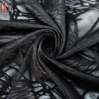 China 88% Polyester 12% Spandex Fabric , White Black Ice Silk Petal Jacquard Clothing Fabric for sale