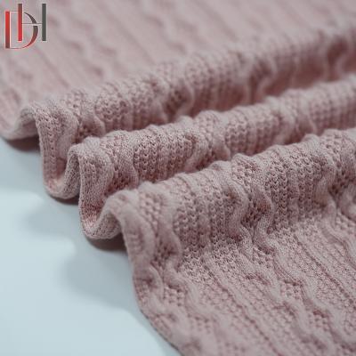 China Winter Pink Garment Soft Sweater Braid Cap Jacquard Knitted Textile Fabric for sale