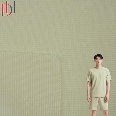 China 65% Polyester 35% Cotton 250gsm Polo Shirt Fabric Organic Cotton Waffle Fabric Combed Yarn for sale