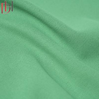 China Good Elasticity Cotton Blended Pique Knit Fabric Wholesale Apparel Raw Material for sale
