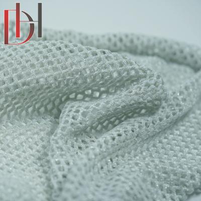 China 160cm 125gsm Lightweight 100% Polyester Diamond Mesh Jacquard Knitted Fabric For Ladies Fashion Apparel for sale