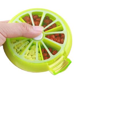 China Small weekly medicine dispenser mini kid pill box  7 cases  round tablet case for children or adult for sale