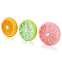 China Small weekly medicine dispenser mini kid pill box  7 cases  round tablet case for children or adult for sale