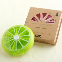 China Small weekly medicine dispenser mini kid pill box  7 cases  round tablet case for children or adult for sale