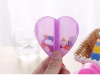 China Can rotation Cute Heart shape pill box with four compartments  and can changed it with oval shape  pill holder for sale