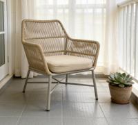 China Modern Handwoven Rope Lounge Chair with Matching Cushion Set Black Frame for Hotel Resort Villa for sale