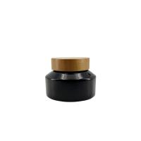 China Black Glass Cosmetic Cream Jar 30ml 50ml Facial Cream Containers With Bamboo Lid for sale