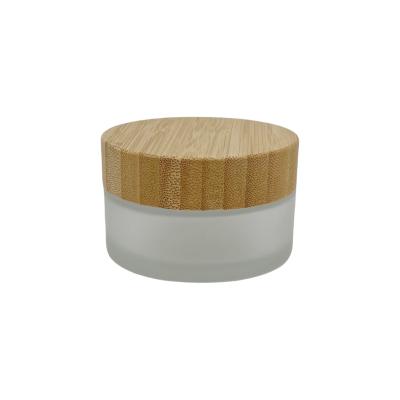 China 30g 50g Frosted Glass Cosmetic Jars Luxury Face Cream Container With Bamboo Lids for sale