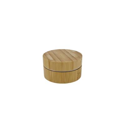 China Aluminum Luxury Cosmetic Jar Cylindrical Body Lotion Container With Bamboo Casings for sale