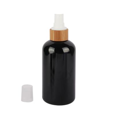China Round Shoulder Cosmetic Spray Bottle Natural Bamboo PET Perfume Spray Bottle Black for sale