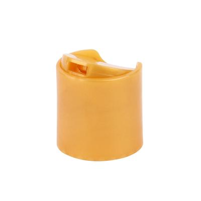China Smooth Plastic Flip Top Cap Golden Yellow Flip Top Closure For Cream for sale