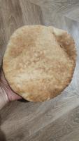 China Fully automatic Arabic bread production line with 800 pcs per hour capacity, food-grade stainless steel construction, and adjustable thickness for sale