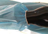 China Blue Waterproof Disposable Isolation Gowns Ties On Neck Elastic Cuff for sale