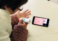 China Skin Analysis Device Digital Skin Analyzer Connected To Mobilephone With Only 100g Weight for sale