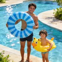 China Customizable Rose Gold Flamingo Inflatable Swim Ring with Pink-Yellow Striped Design for Summer Pool Fun for sale