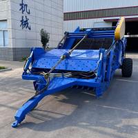 China Heavy Duty 2m Working Width Tractor Stone Picker Machine with Hydraulic Dumping Hopper for Farms & Orchards for sale