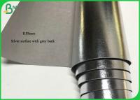 China 0.55mm 0.7mm Thick Untearable Silver Surface Fabric Washable Kraft Paper In Roll for sale