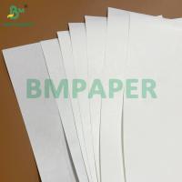 China Food Grade 35g 40g 45g Machine Glazed Bleached Kraft Paper In Reels for sale