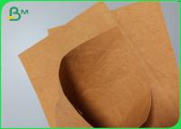 China Washable Good Flexibility 0.55mm Kraft Paper Fabric For Recyclable Wallet Making for sale